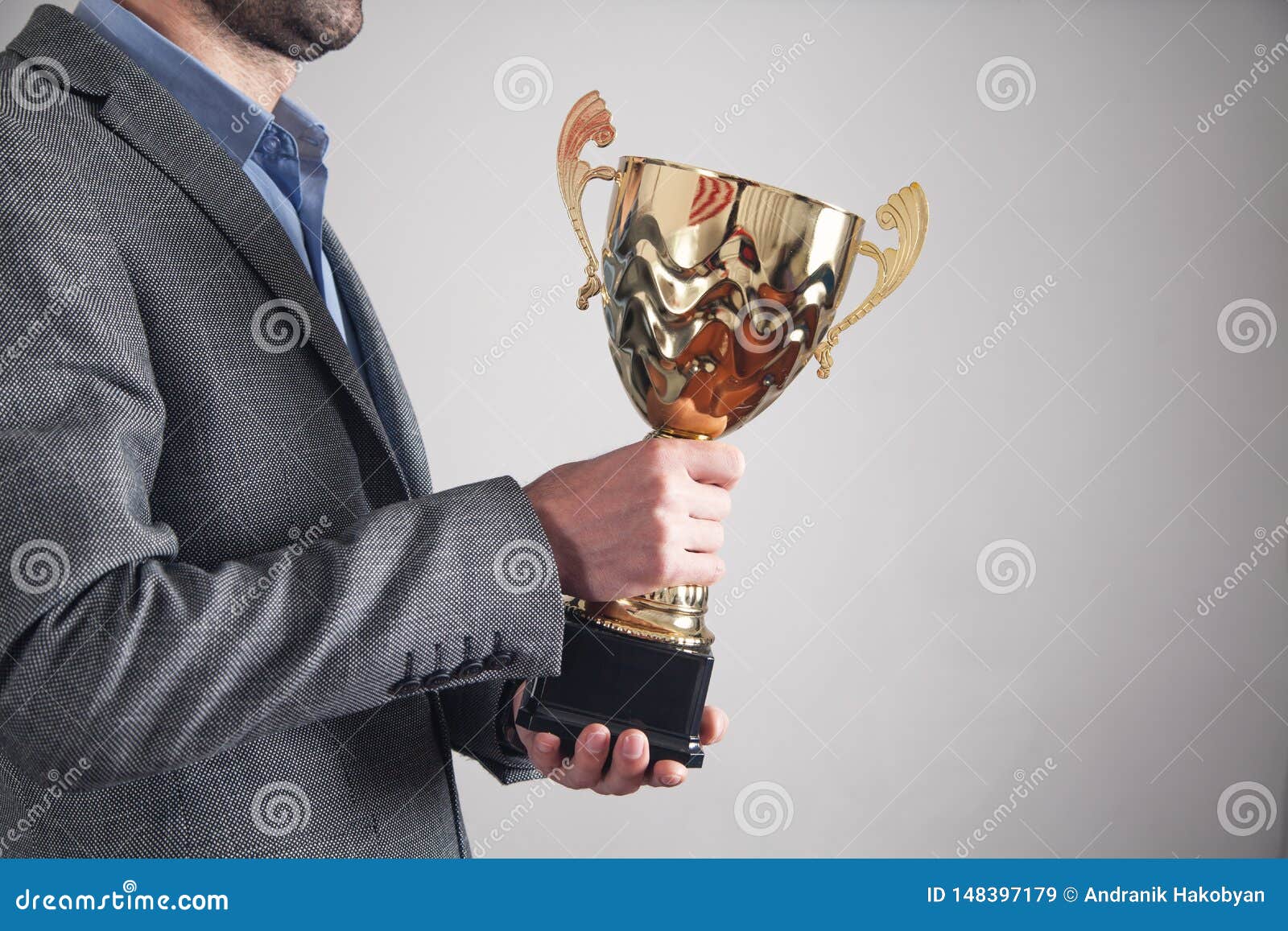 Businessman Holding Golden Trophy Business Success Stock Image
