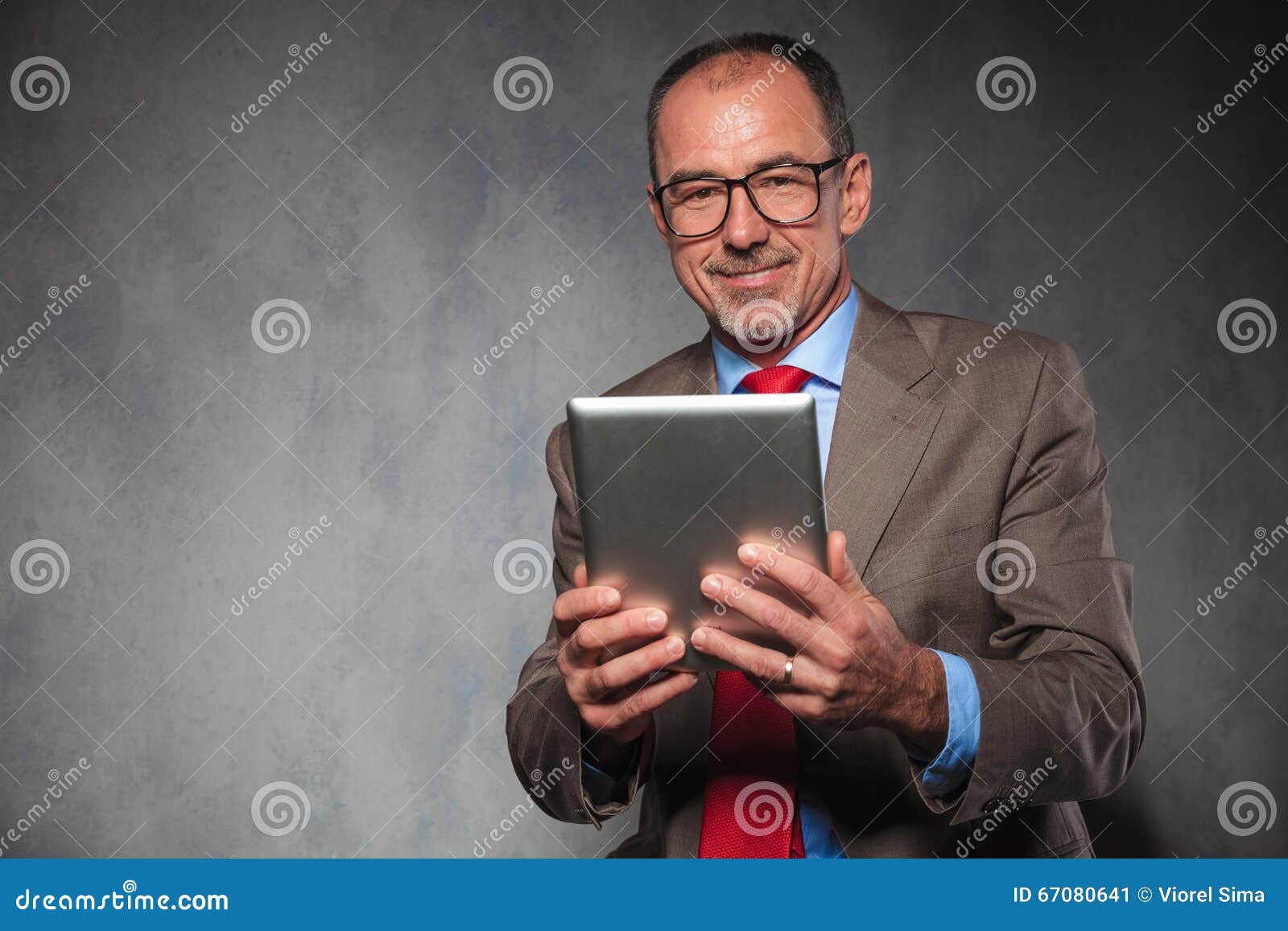 Businessman Holding His Tablet while Posing Stock Image - Image of ...