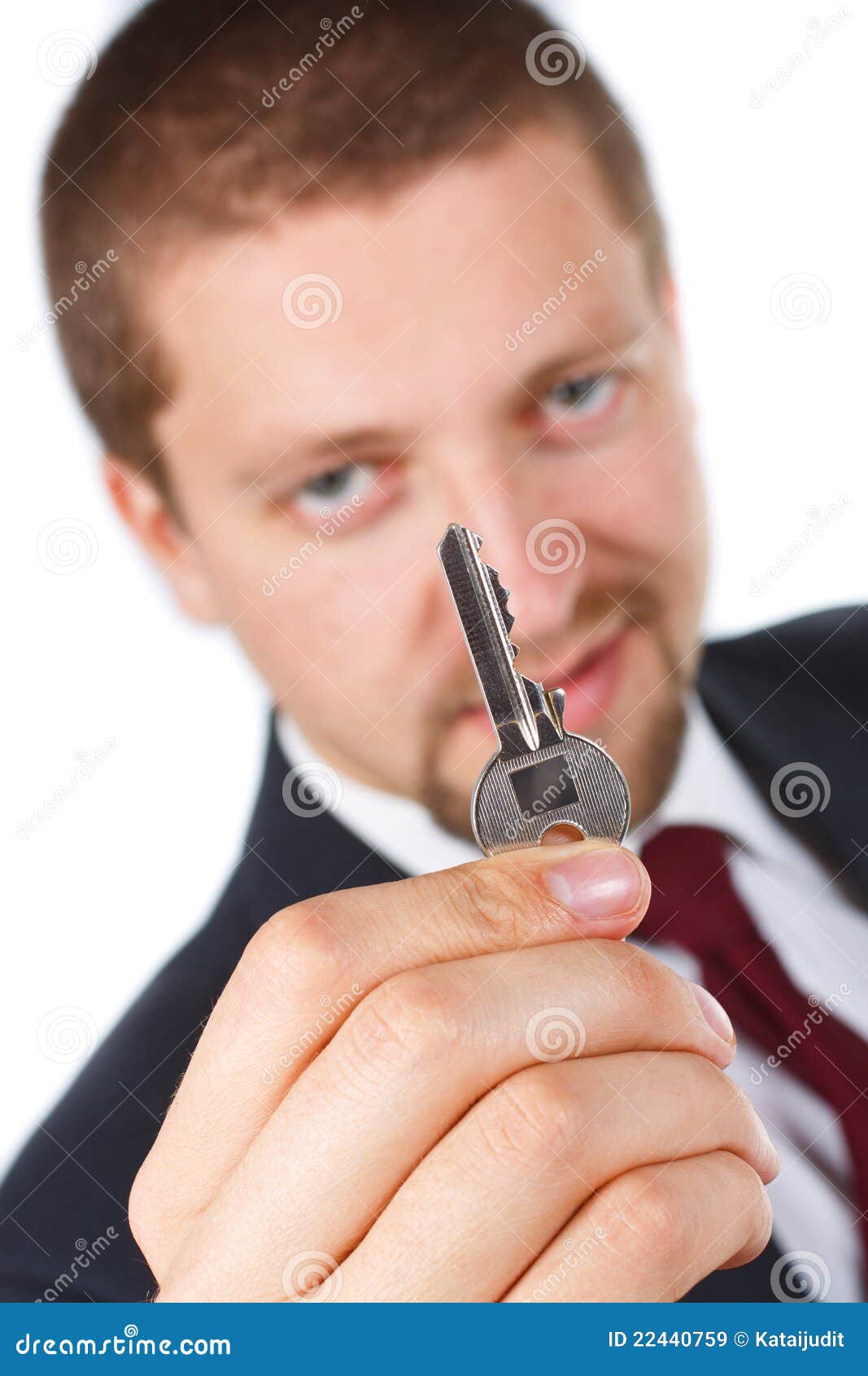 Businessman holding a key stock image. Image of model - 22440759
