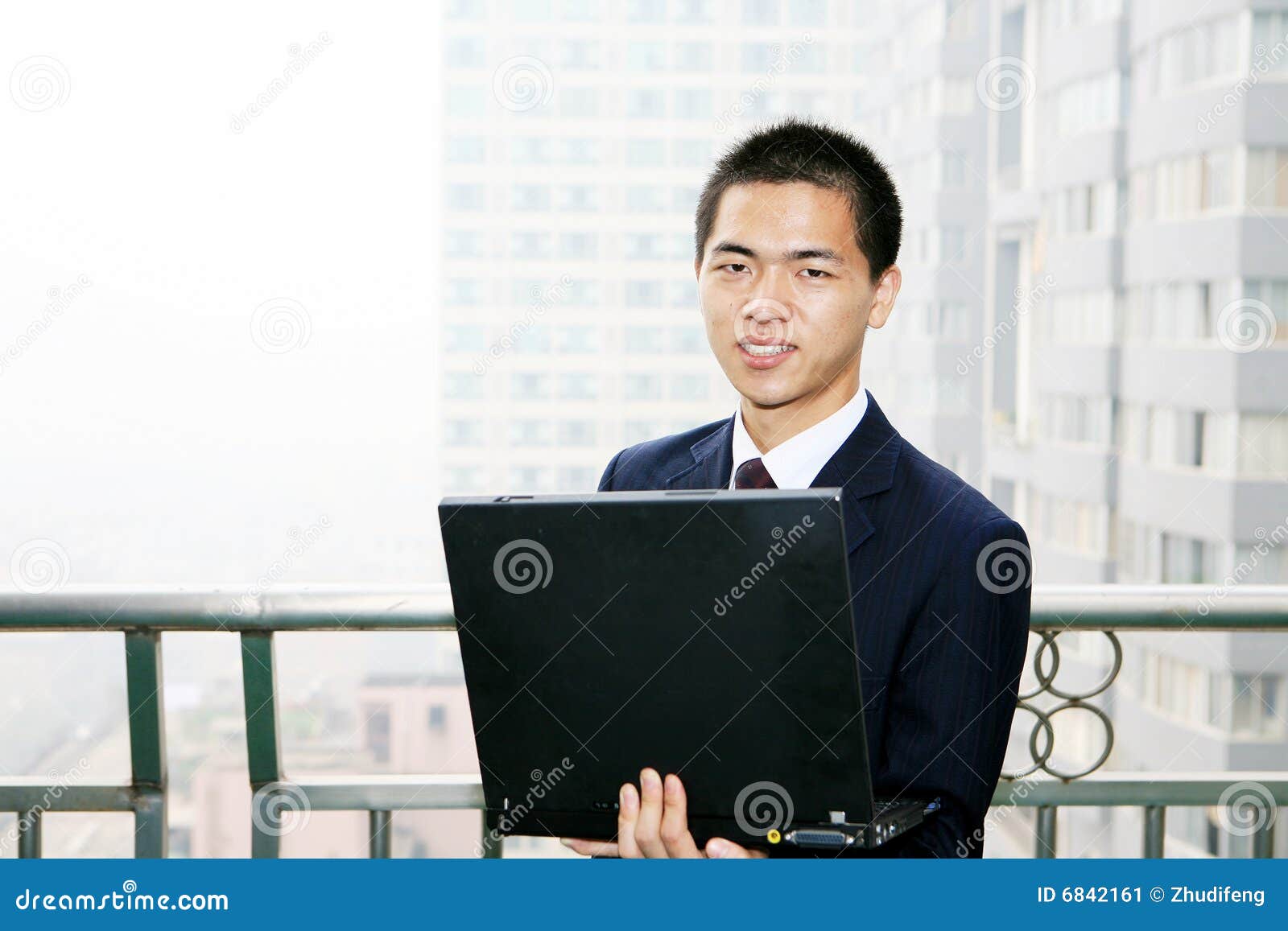 Businessman Holding Laptop Computer Stock Image - Image of businessman ...