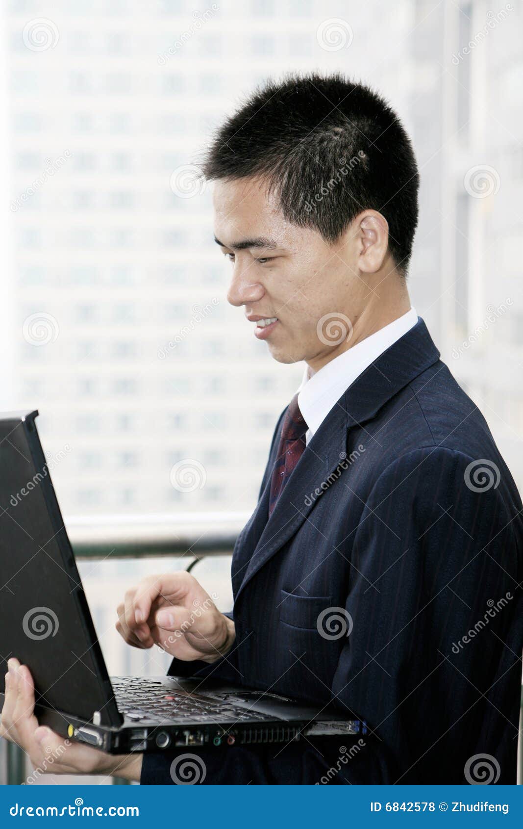 Businessman Holding Laptop Computer Stock Photo - Image of computer ...