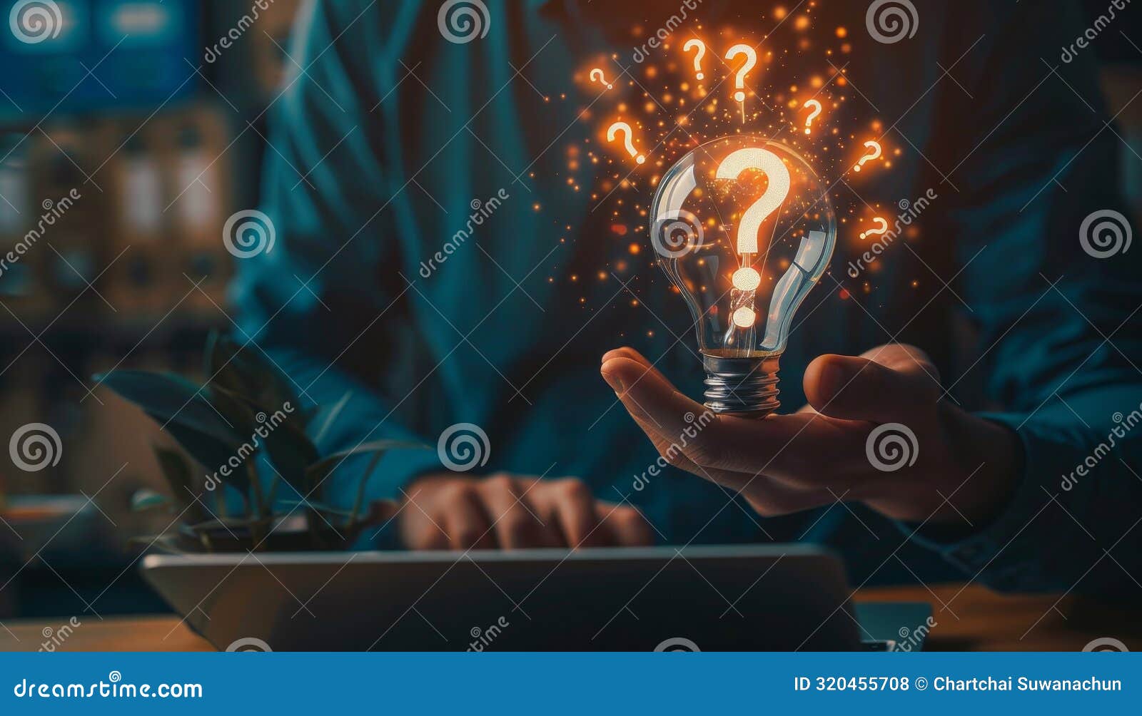 Businessman Holding Light Bulb Icon with Question Marks, Concept of ...