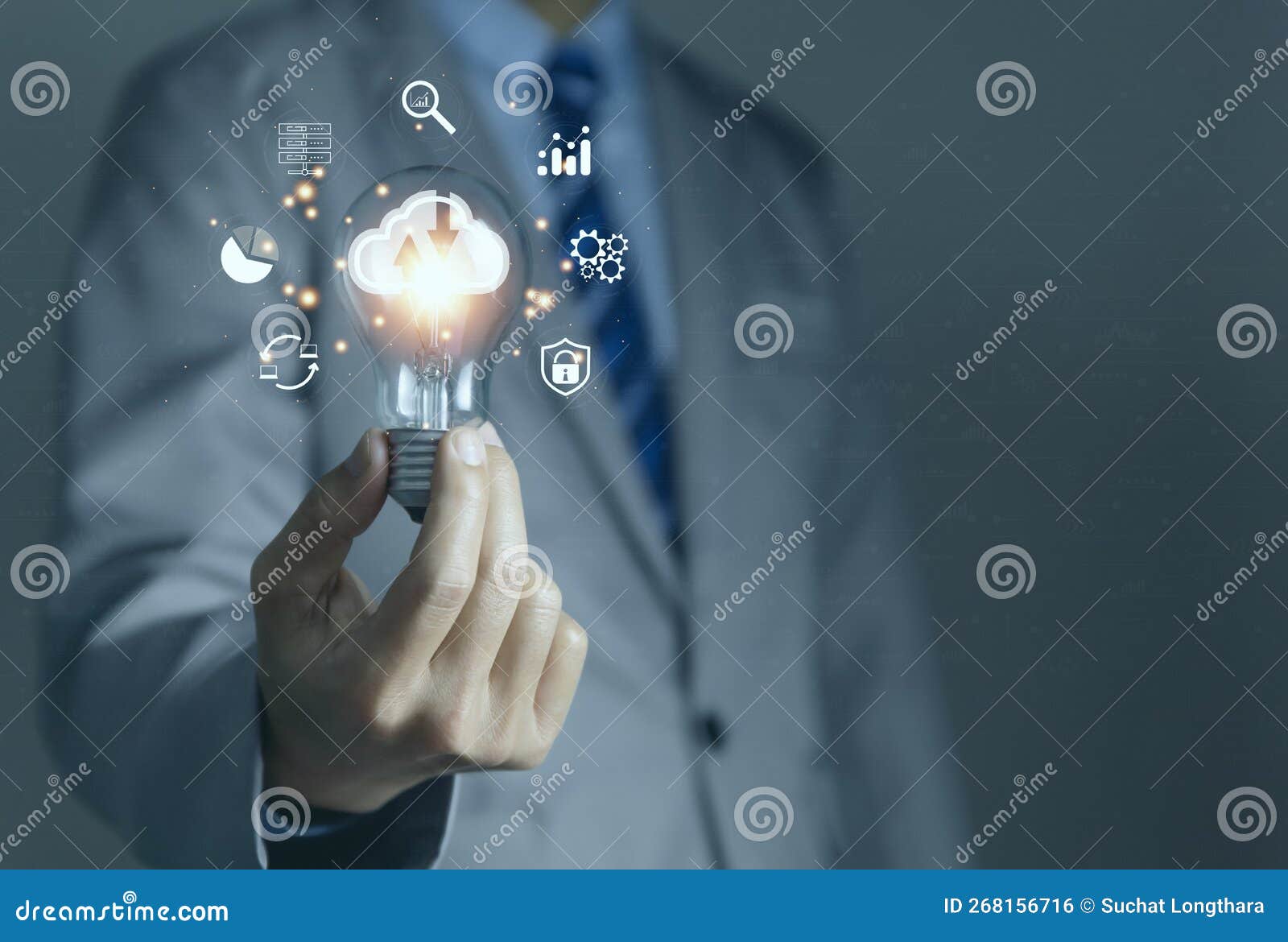 Businessman Holding a Light Bulb Showing a Diagram of Cloud Computing ...