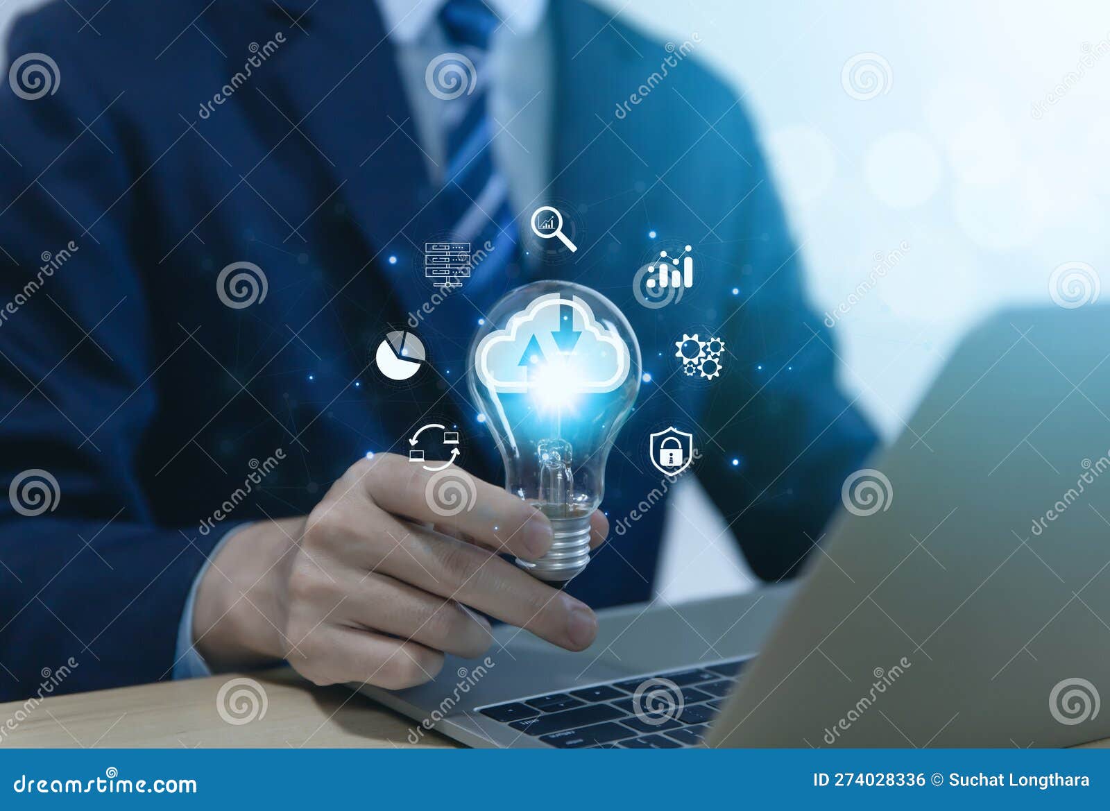 Businessman Holding a Light Bulb Showing a Diagram of Cloud Computing ...