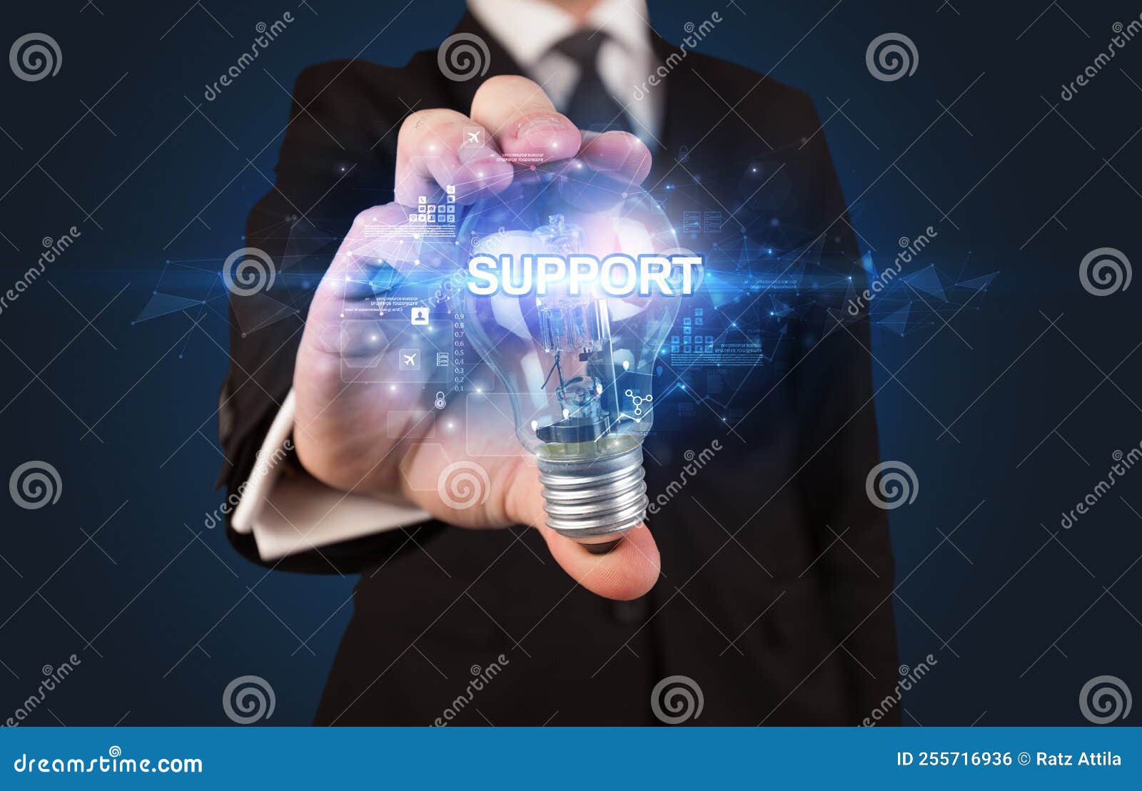 Businessman Holding a Light Bulb Stock Photo - Image of holding ...
