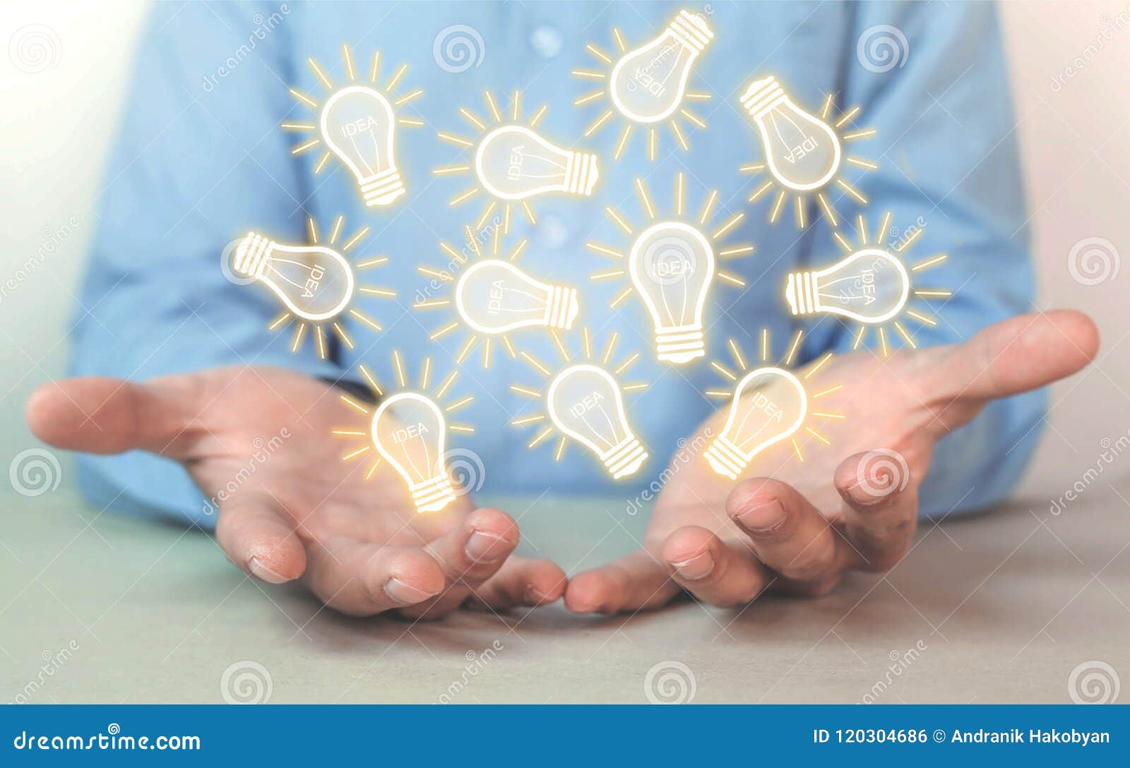 Businessman Holding Light Bulbs. Concept of New Idea Stock Photo ... Businessman Holding Light Bulbs. Concept of New Idea Stock Photo ...