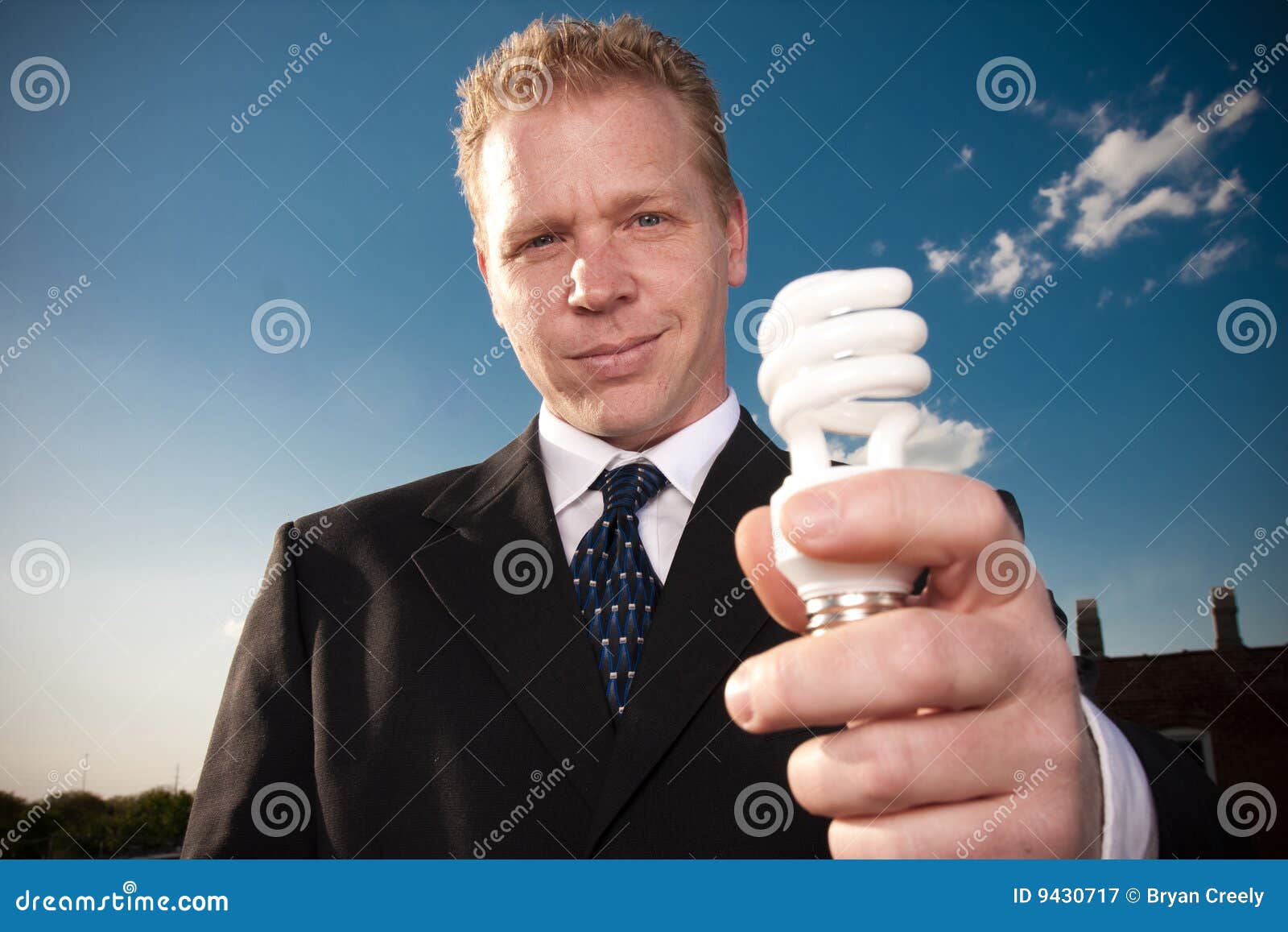 Businessman Holding Lightbulb Stock Image - Image of business ...