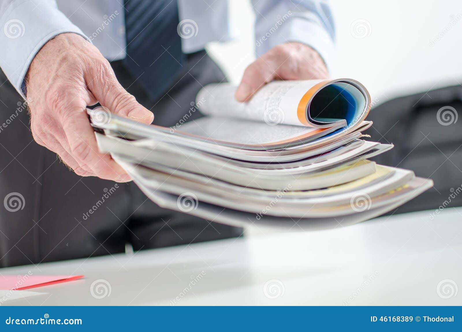 Businessman Holding Magazines Stock Image - Image of desk, article ...