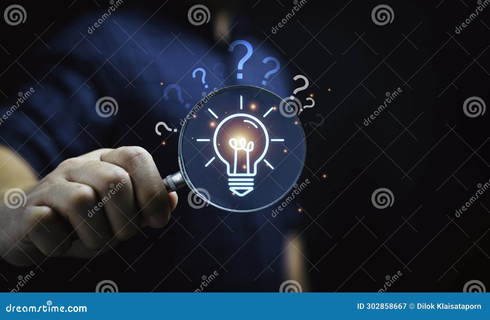 Businessman Holding Magnifier Glass with Virtual Glowing Lightbulb with ...