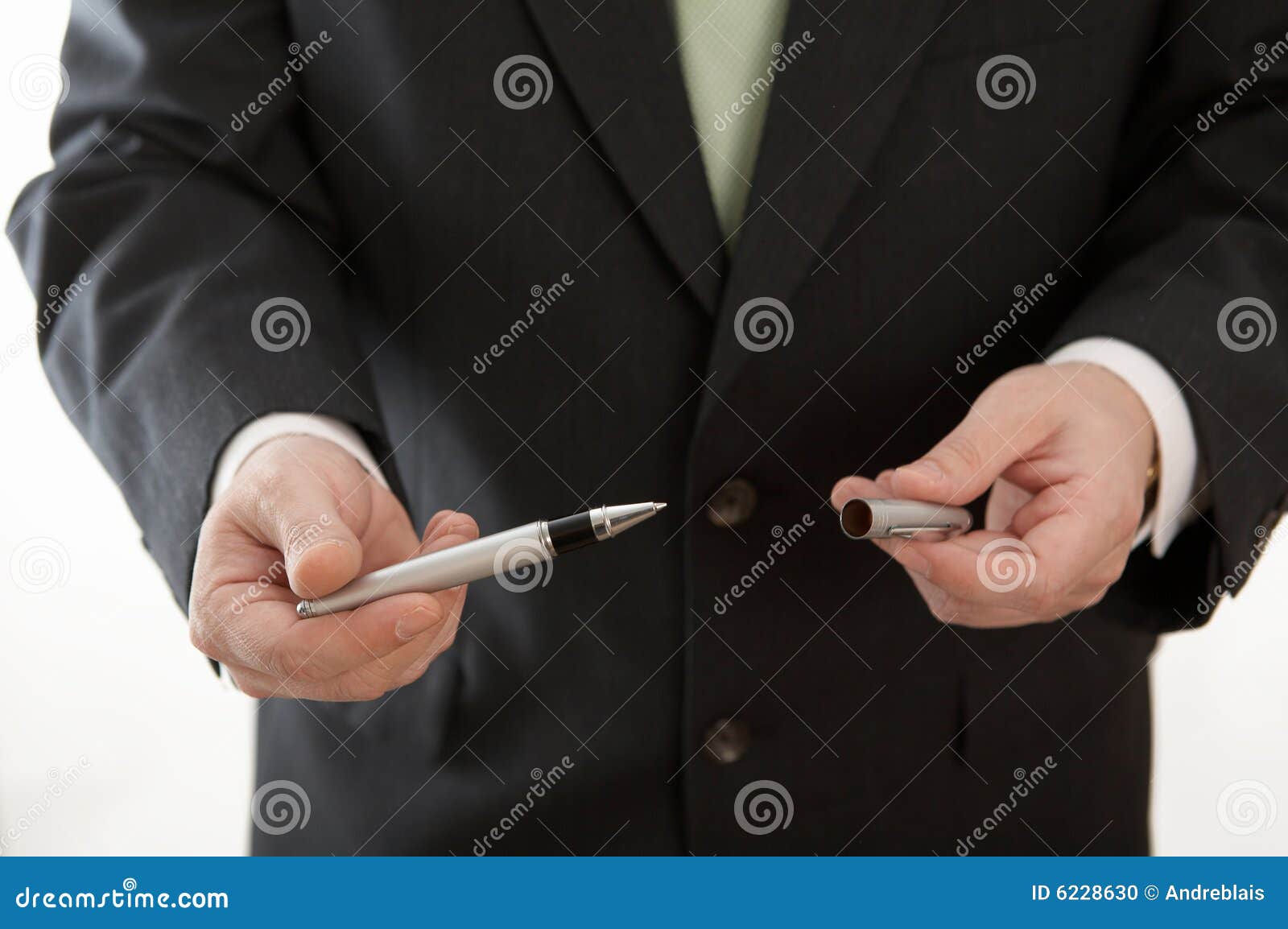 Businessman holding pen stock photo. Image of purchase - 6228630