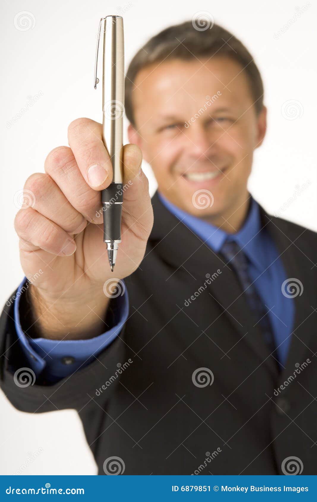 Businessman Holding a Pen stock image. Image of middle - 6879851
