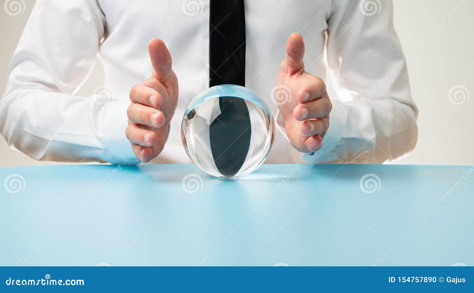 Businessman Holding Protective Hands Over a Crystal Ball Stock Photo ...