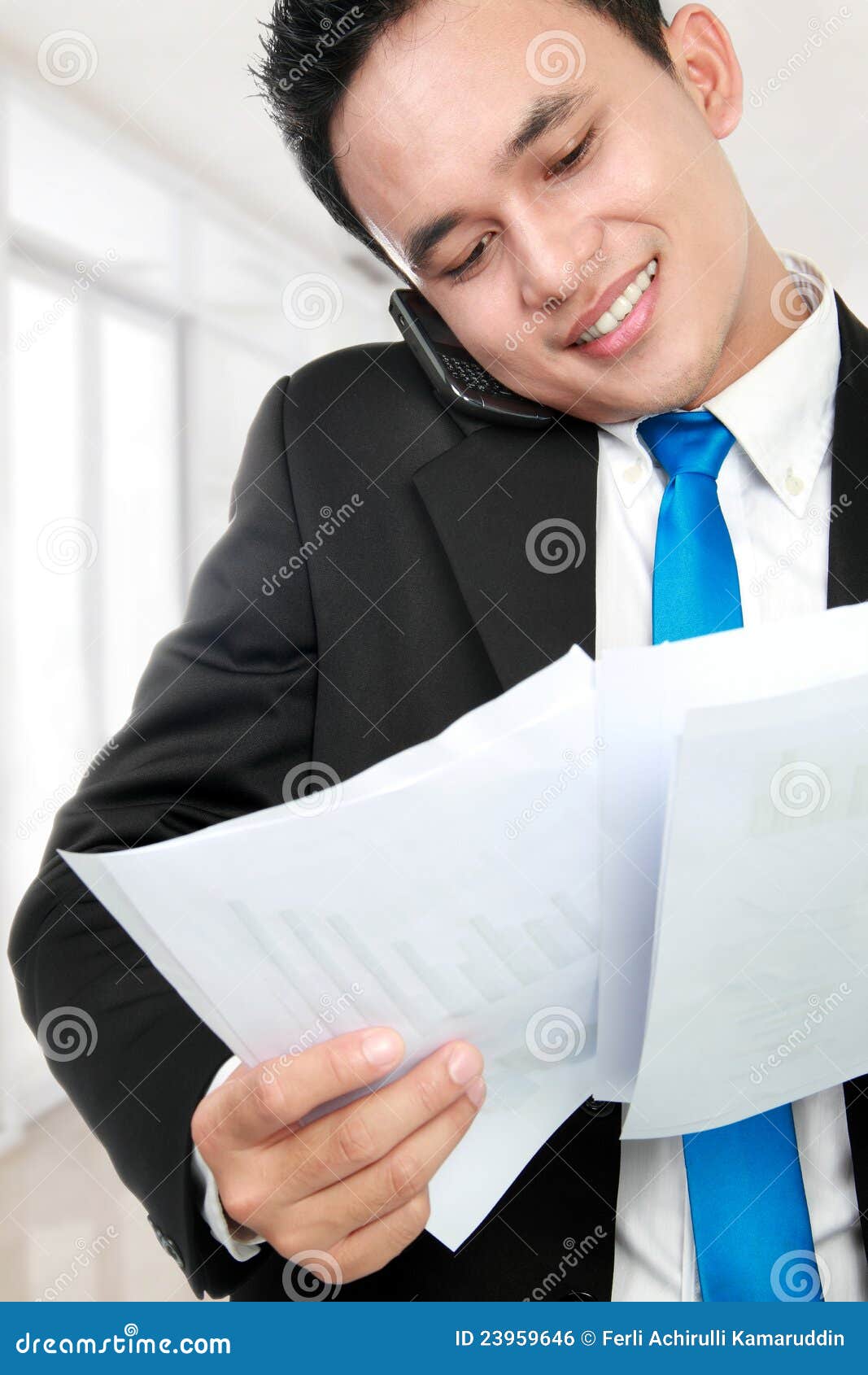 Businessman Holding a Report Stock Photo - Image of attractive ...