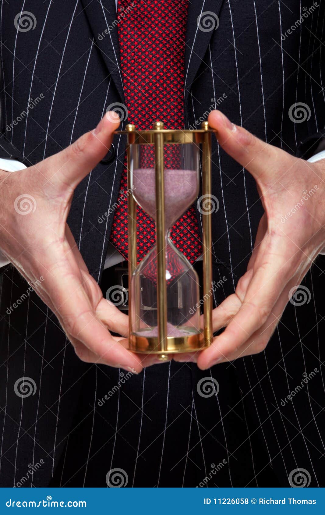 Businessman Holding a Sand Timer Stock Photo - Image of hourglass, time ...