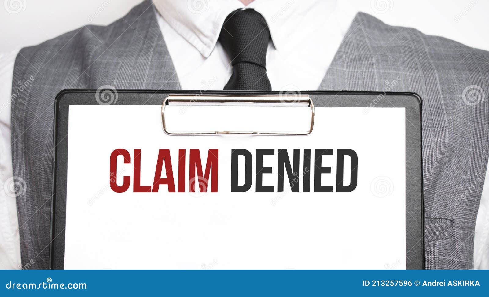 Businessman Holding Sheet of Paper with a Message CLAIM DENIED Stock ...