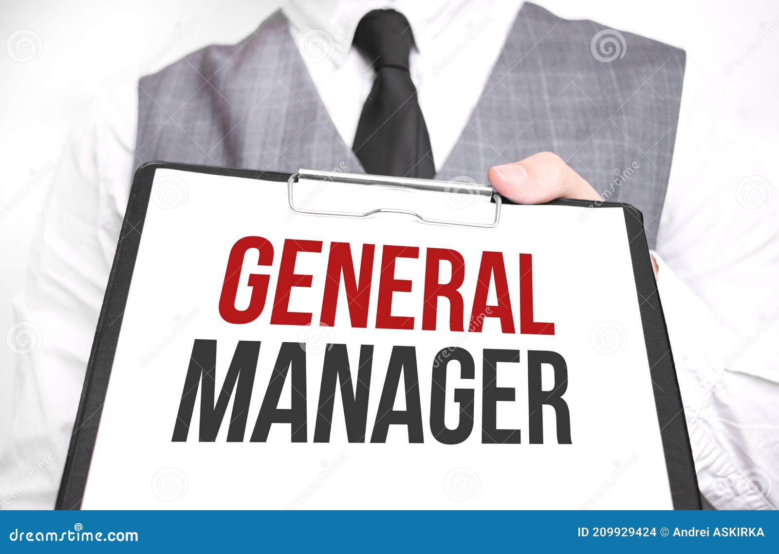 Businessman Holding Sheet of Paper with a Message GENERAL MANAGER Stock ...