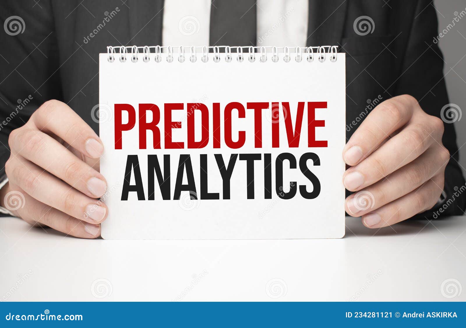 Businessman Holding Sheet of Paper with a Message PREDICTIVE ANALYTICS ...