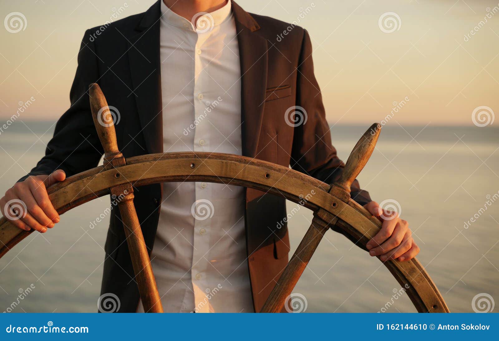 Businessman Holding Ship Wheel and Navigates Stock Photo - Image of ...