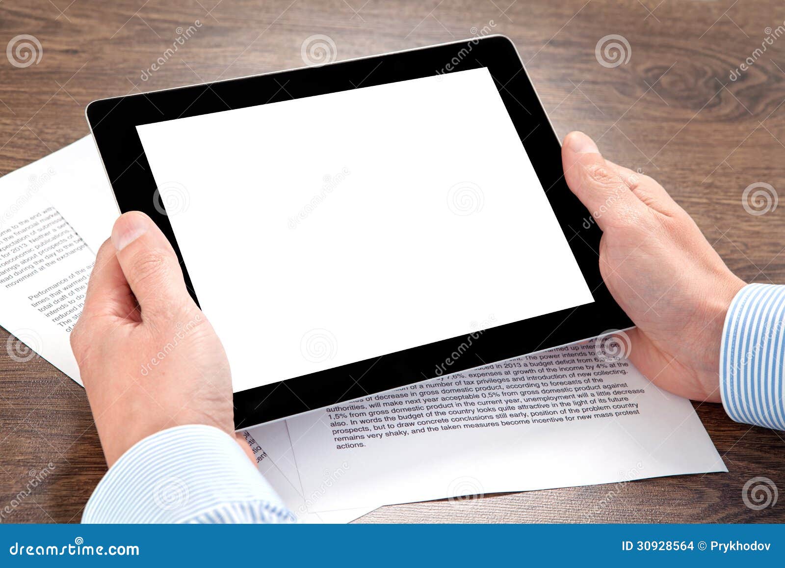 Businessman Holding a Tablet on the Table with Documents Stock Photo ...