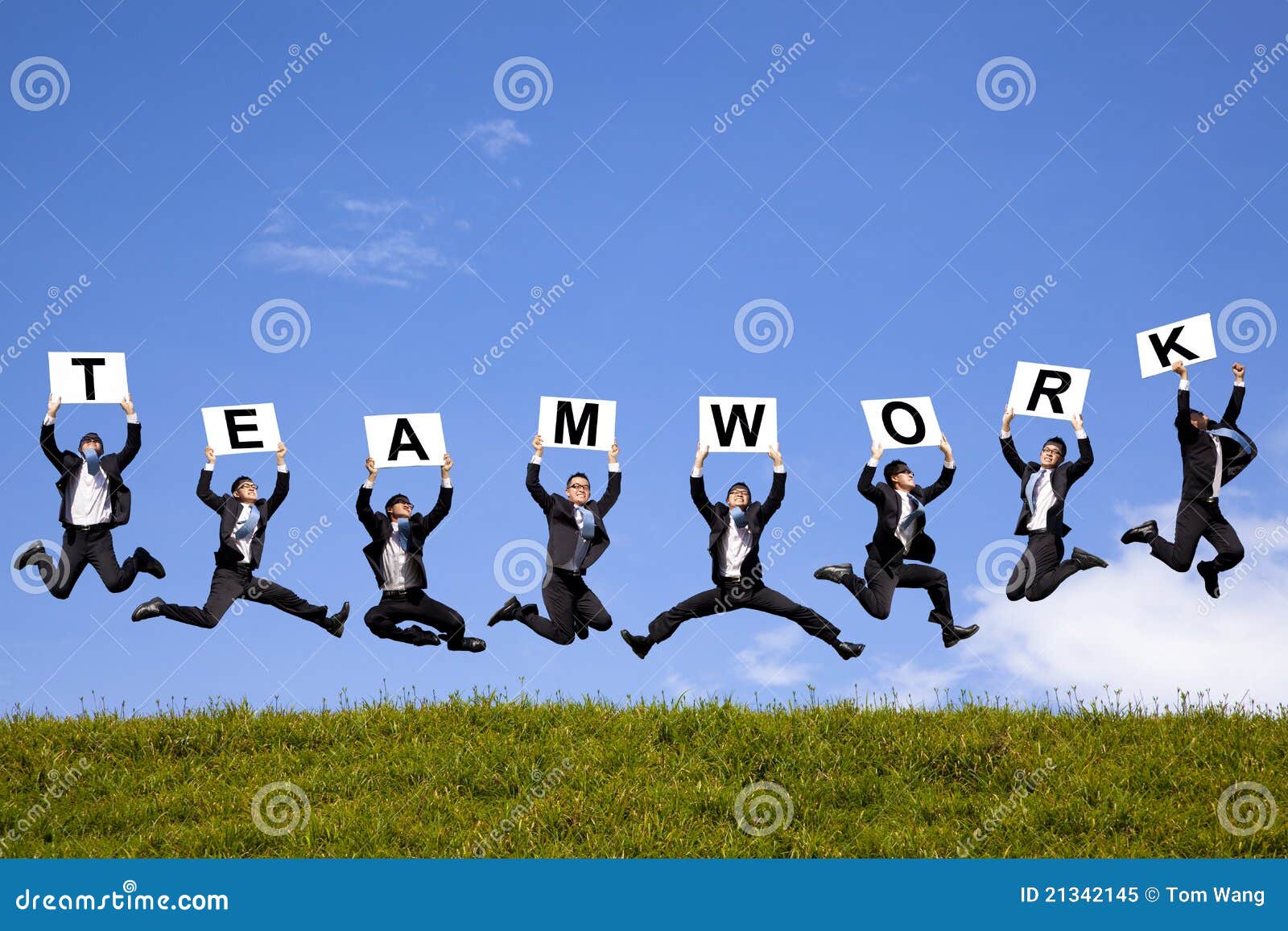 Businessman Holding Teamwork Text and Jumping Stock Image - Image of ...