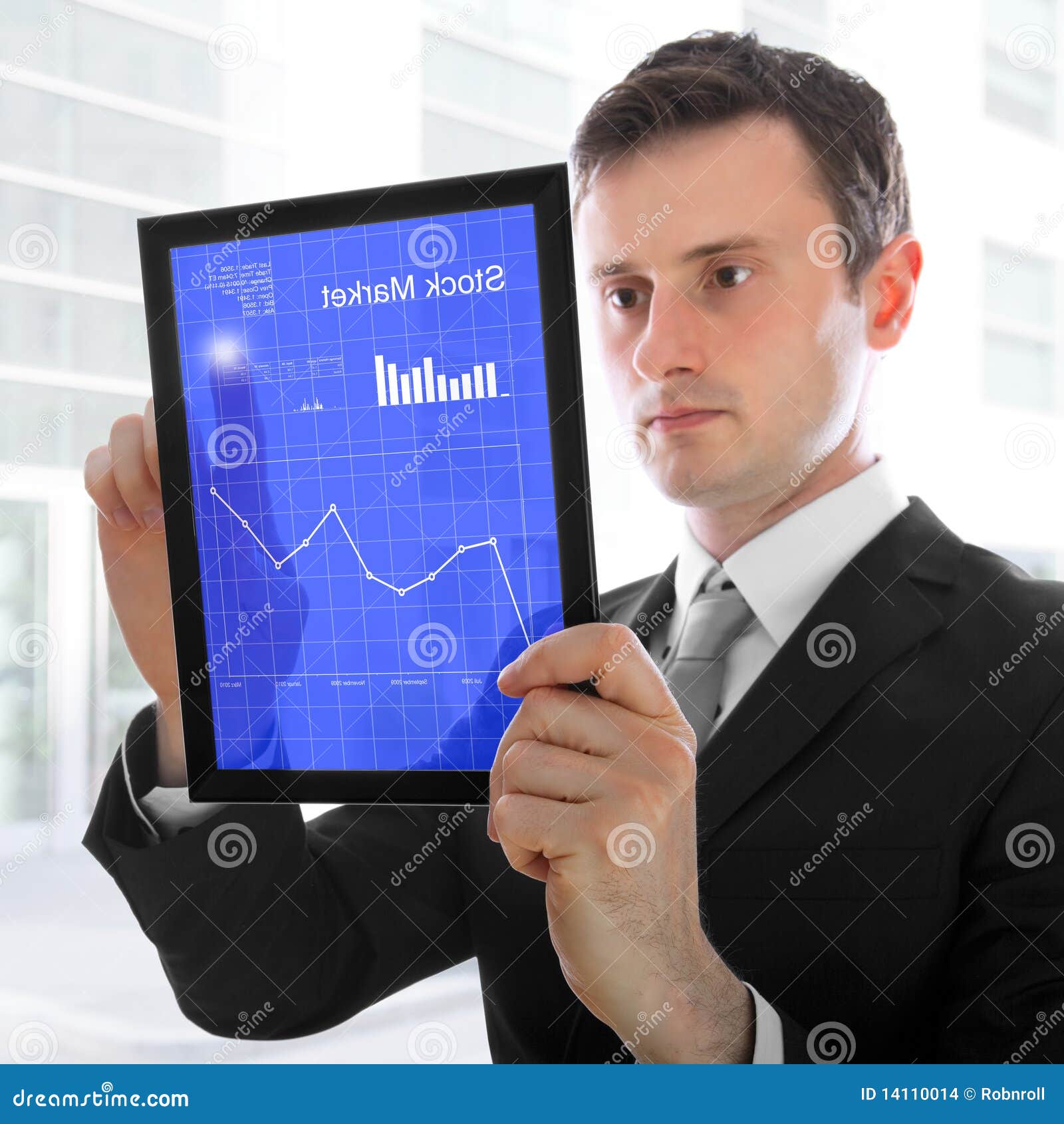 Businessman Holding a Touchpad Pc, Checking Stocks Stock Photo - Image ...