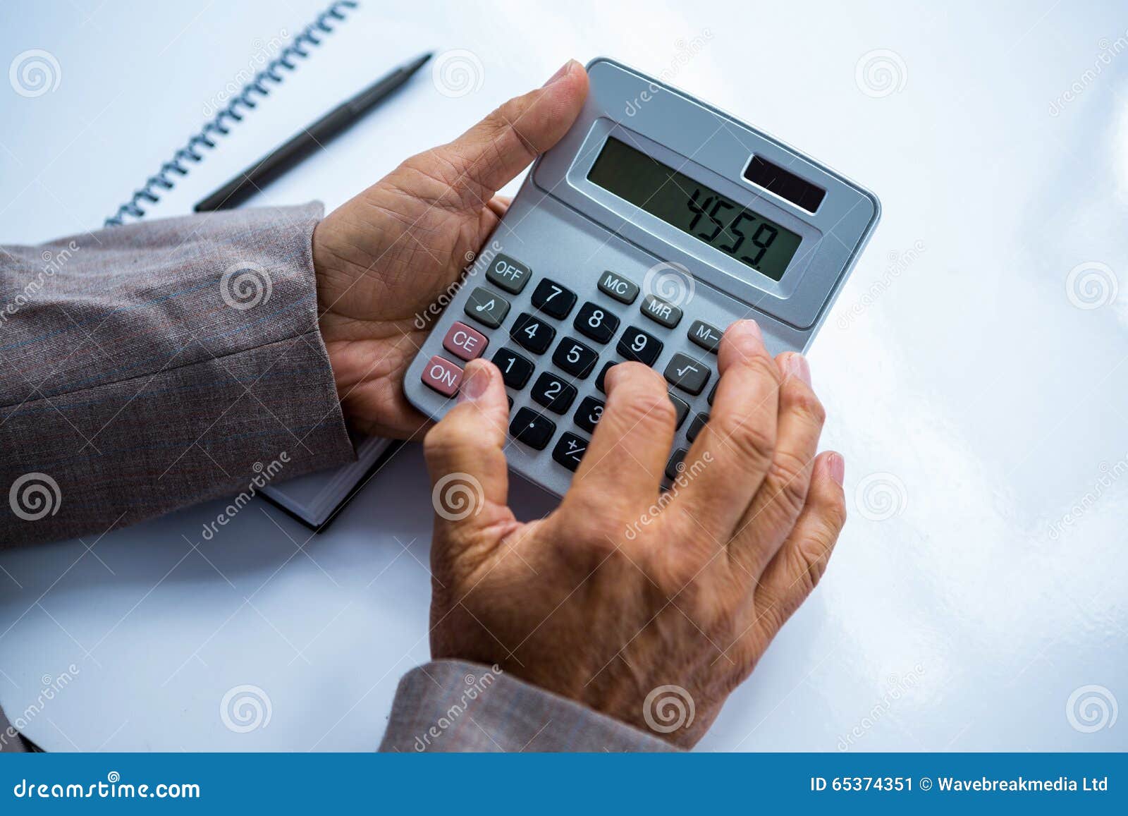 Businessman Holding and Using Calculator Stock Image - Image of hand ...