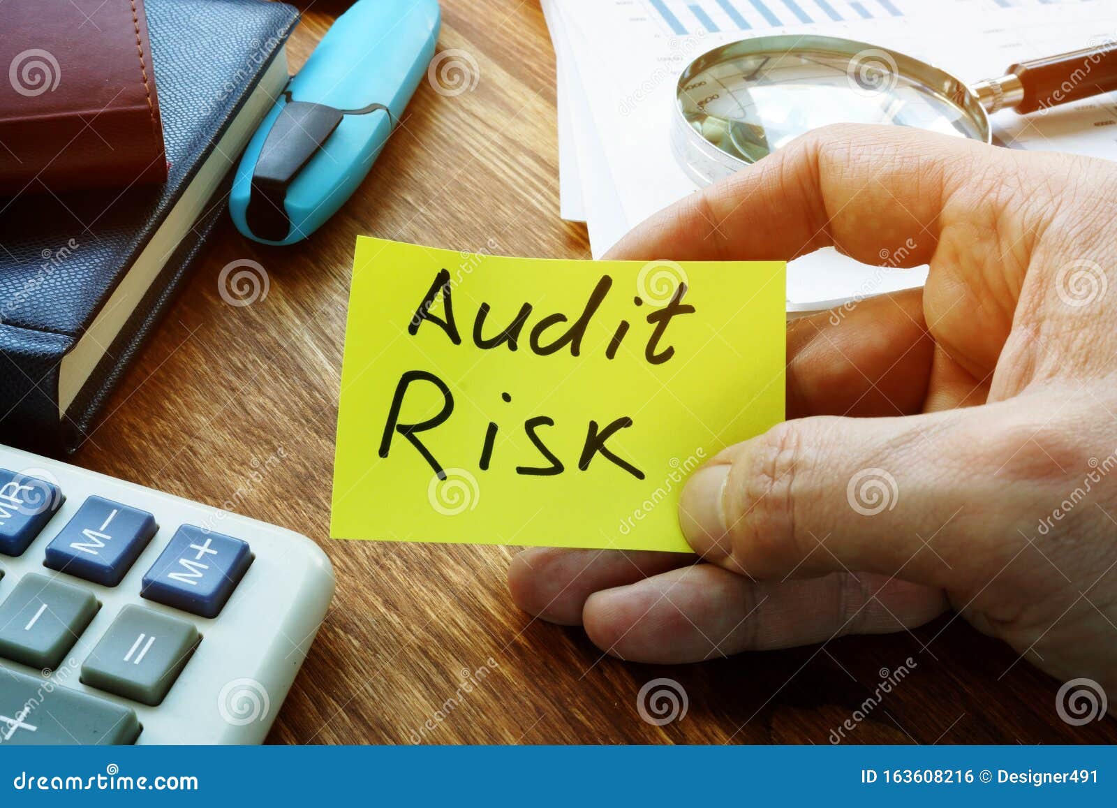 Businessman Holds Audit Risk Sign on a Sheet Stock Photo - Image of ...