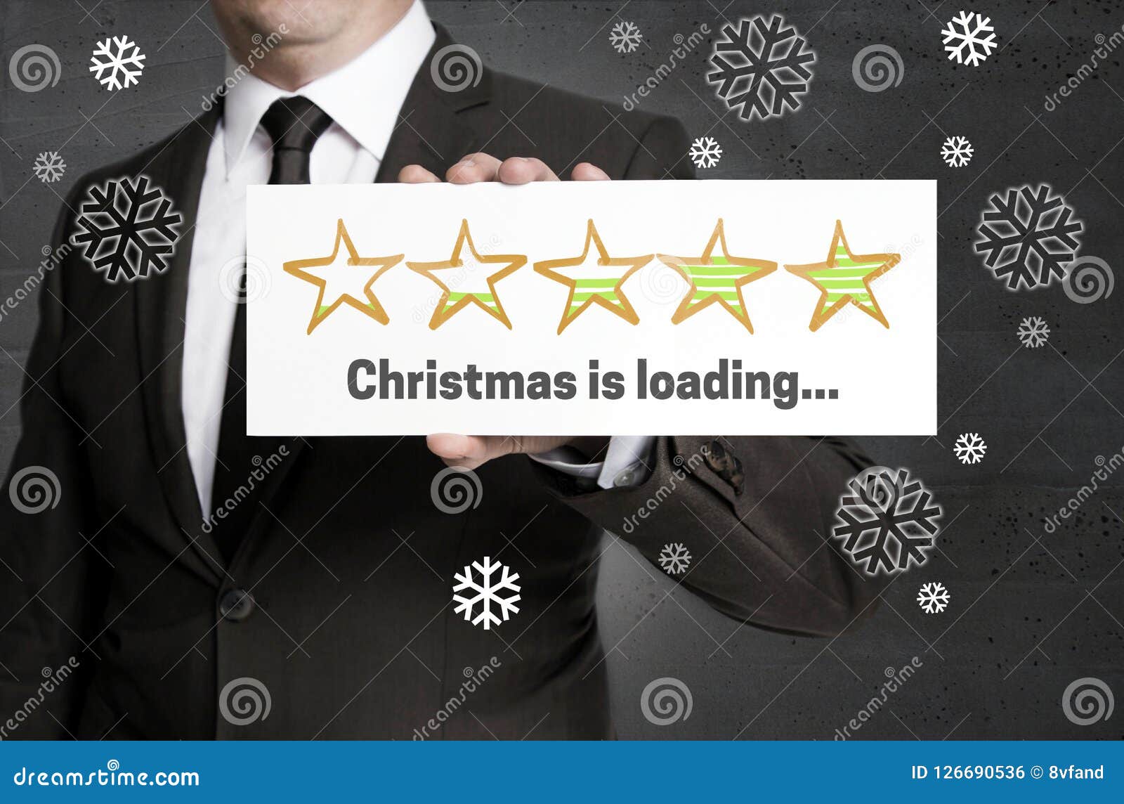 Businessman Holds Christmas is Loading Sign Stock Photo - Image of ...