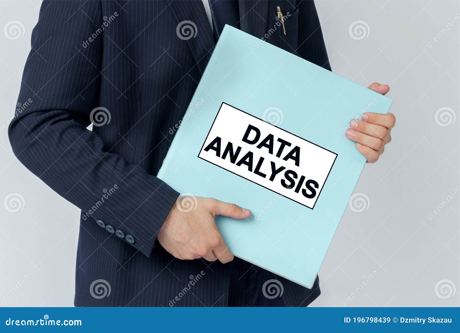 A Businessman Holds a Folder with Documents, the Text on the Folder is ...