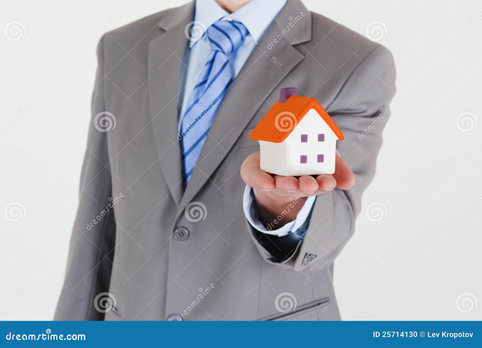 Businessman with a house stock photo. Image of offer - 25714130