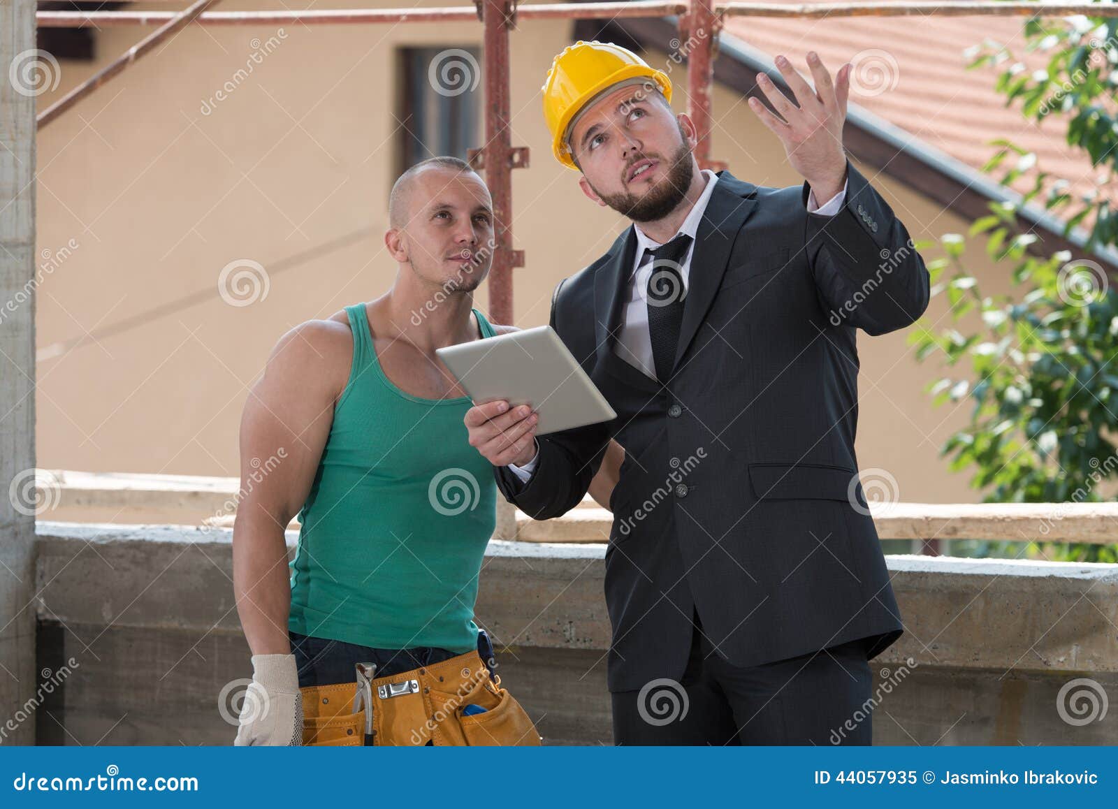Businessman and Industrial Worker Looking at Tablet PC Stock Image ...