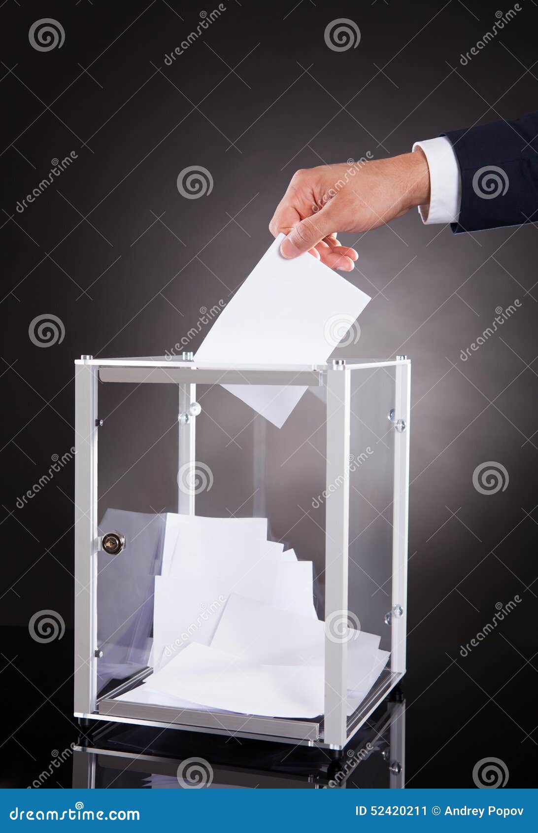 Businessman Inserting Ballot in Box on Desk Stock Image - Image of ...