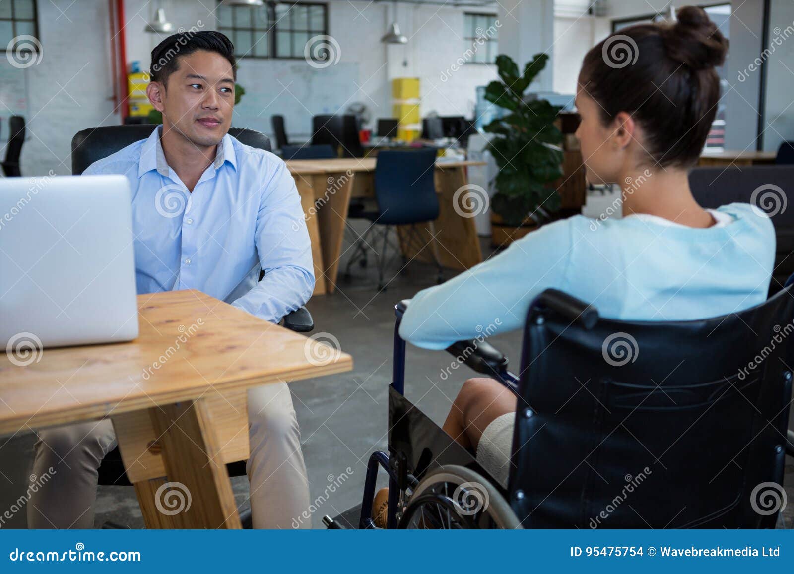 Businessman Interacting with Disabled Colleague Stock Photo - Image of ...