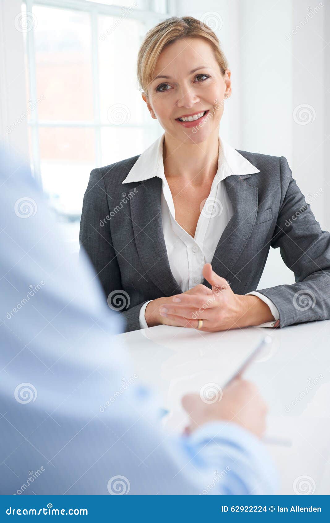 Businessman Interviewing Female Job Candidate Stock Photo - Image of ...