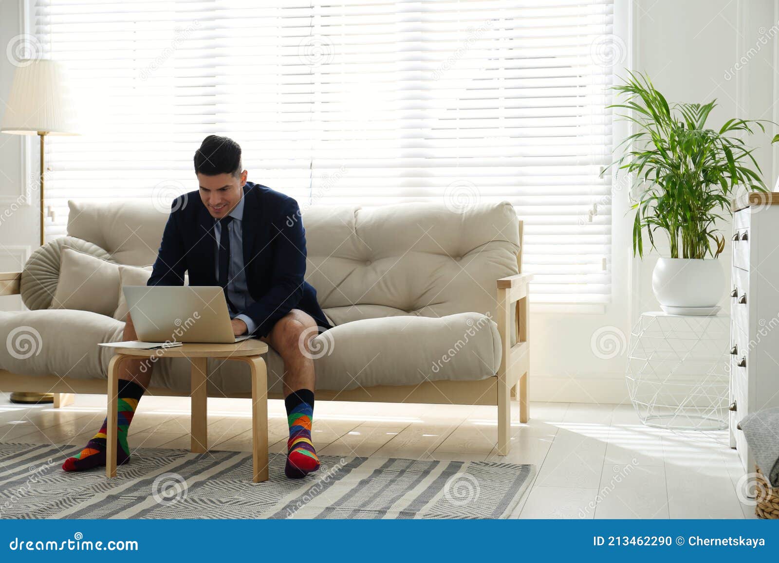 Businessman in Jacket and Underwear Working on Laptop at Home Stock ...