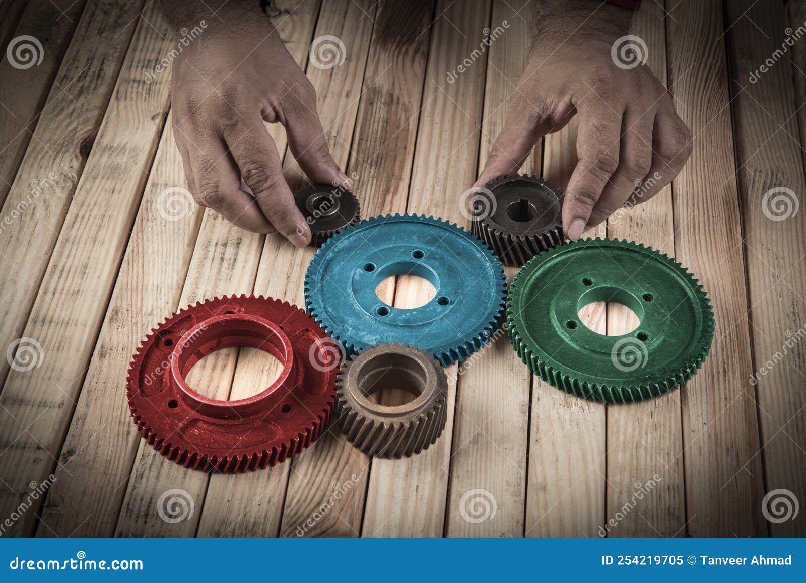 Businessman Joining Gears Together. Concept of Solution To Complex ...