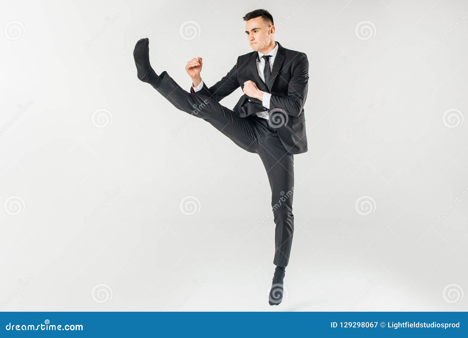 Businessman Jumping and Performing Kick in Suit Stock Image - Image of ...
