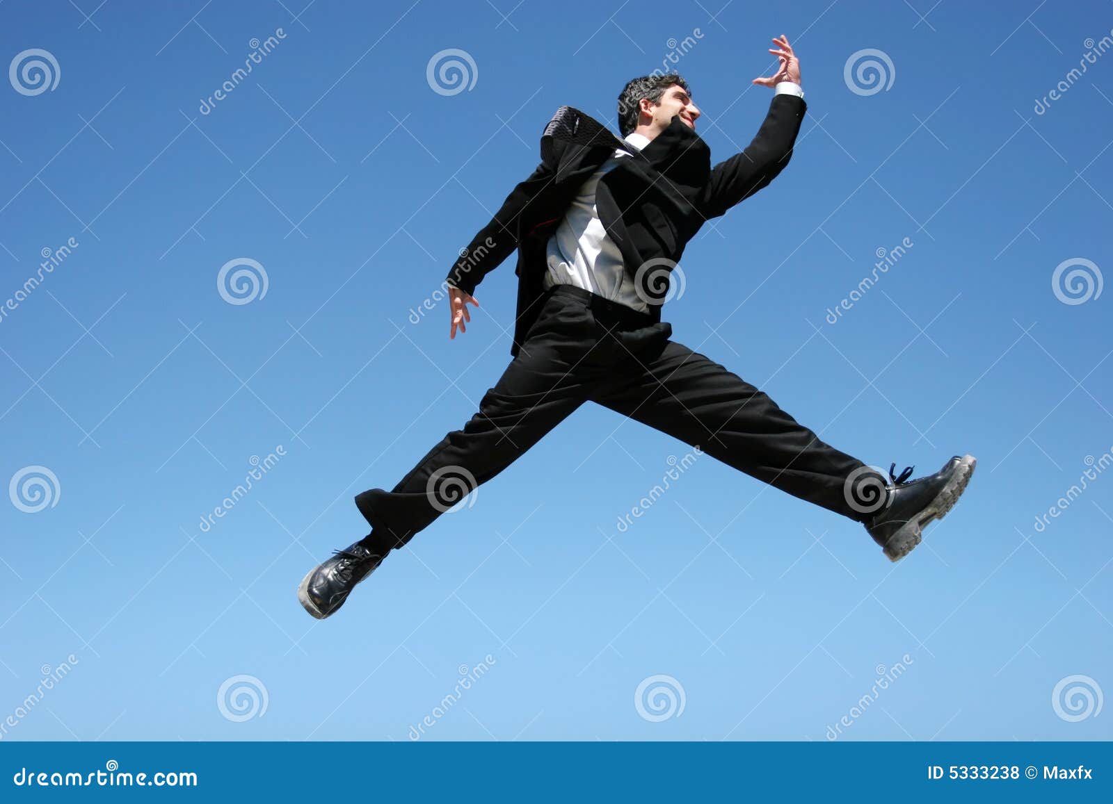 Businessman Jumping for Success Stock Photo - Image of vision, serious ...