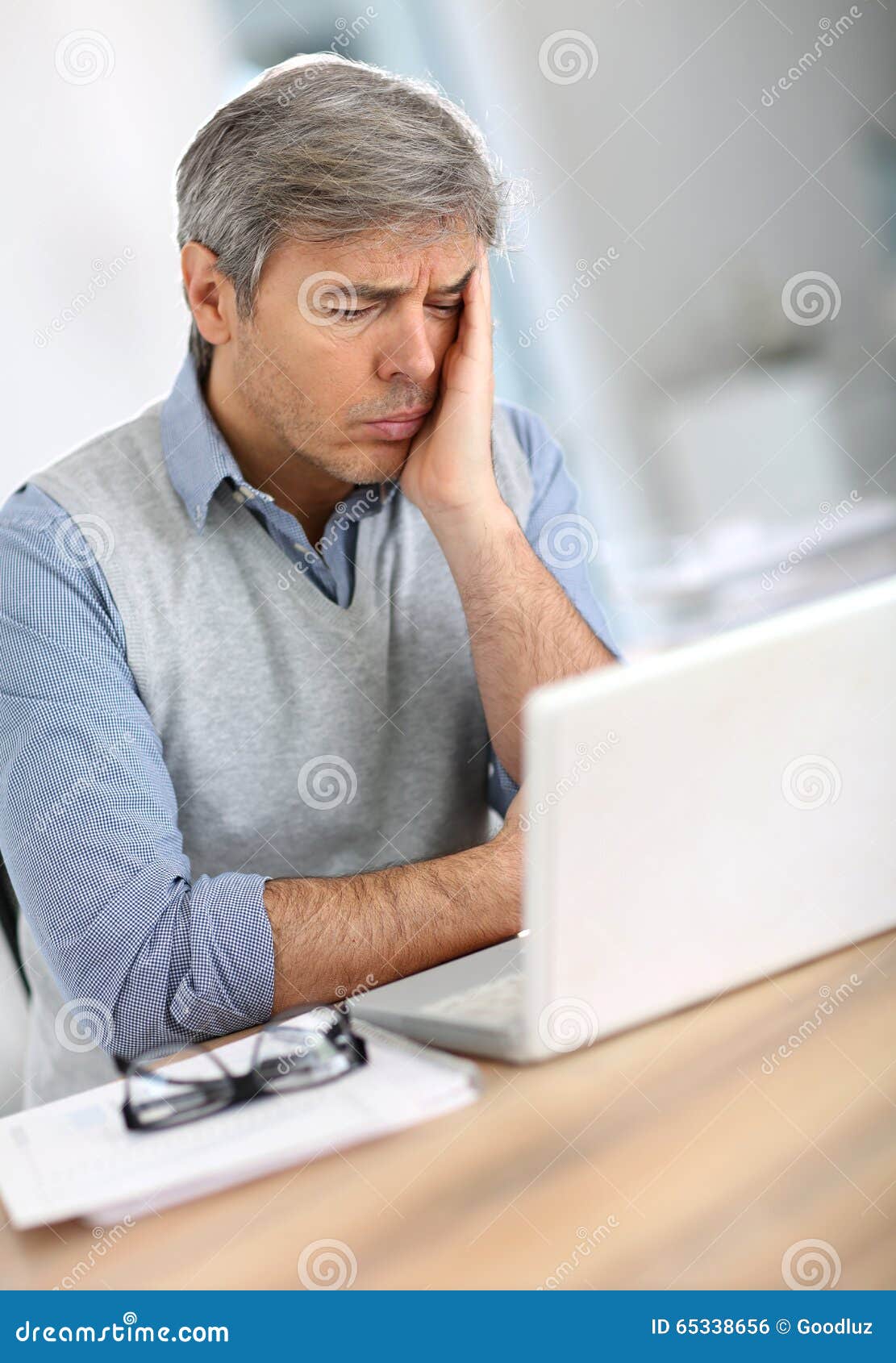 Businessman with Laptop Being Concerned Stock Photo - Image of sitting ...