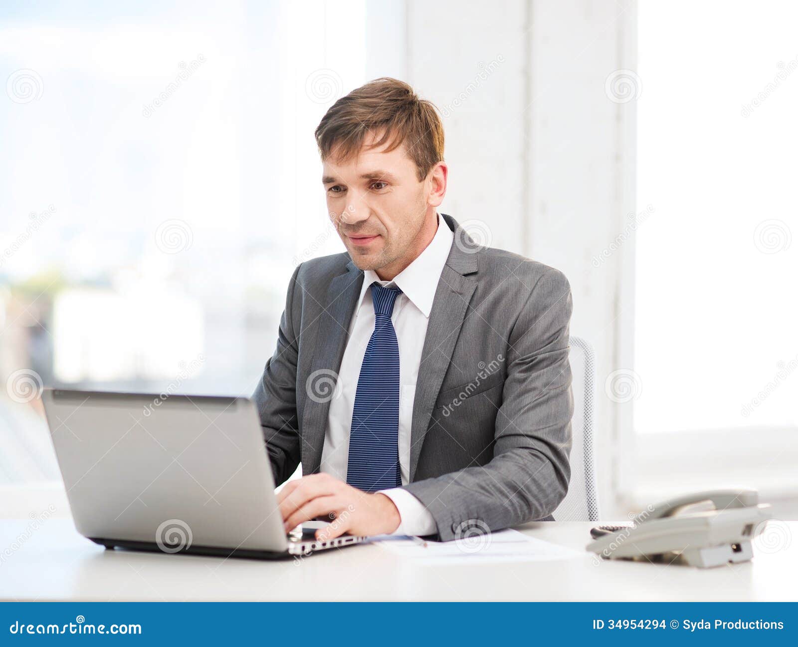 Businessman with Laptop Computer and Documents Stock Photo - Image of ...
