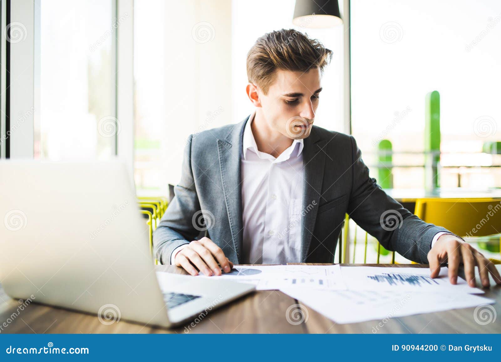 Businessman with Laptop Computer and Papers Working in Office Stock ...
