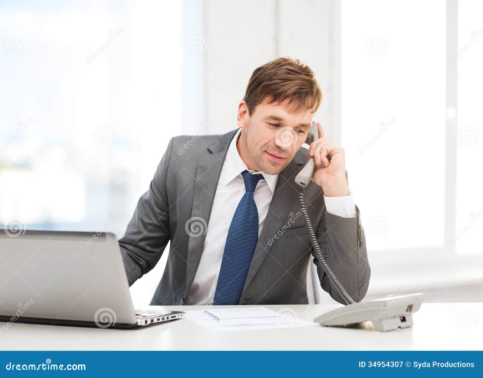 Businessman with Laptop Computer and Phone Stock Image - Image of ...