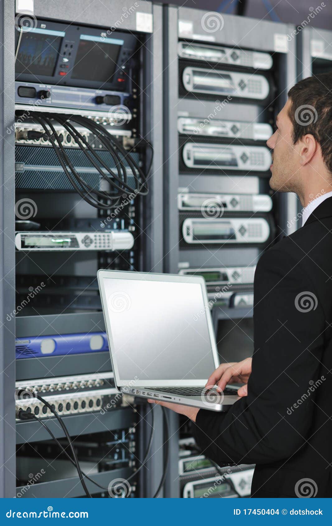 Businessman with Laptop in Network Server Room Stock Photo - Image of ...