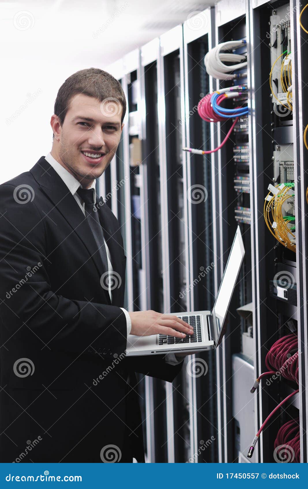 Businessman with Laptop in Network Server Room Stock Image - Image of ...