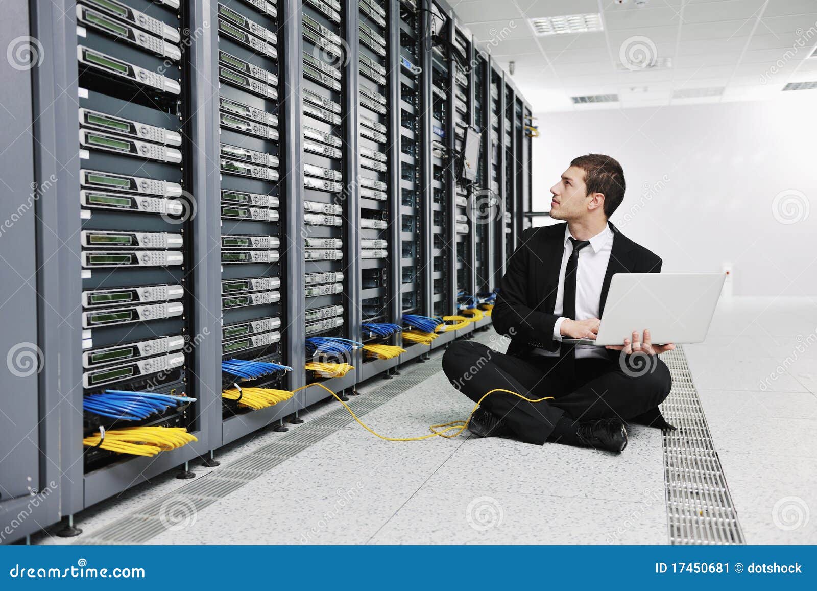 Businessman with Laptop in Network Server Room Stock Image - Image of ...