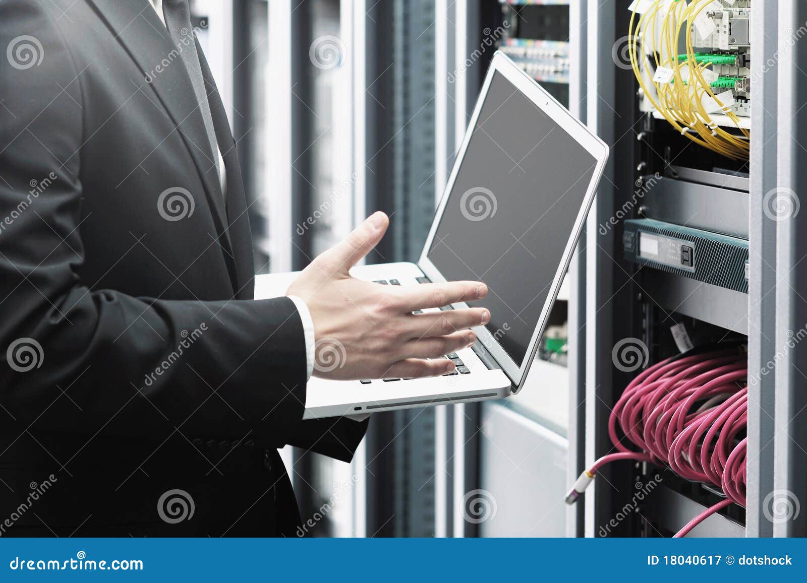 Businessman with Laptop in Network Server Room Stock Image - Image of ...