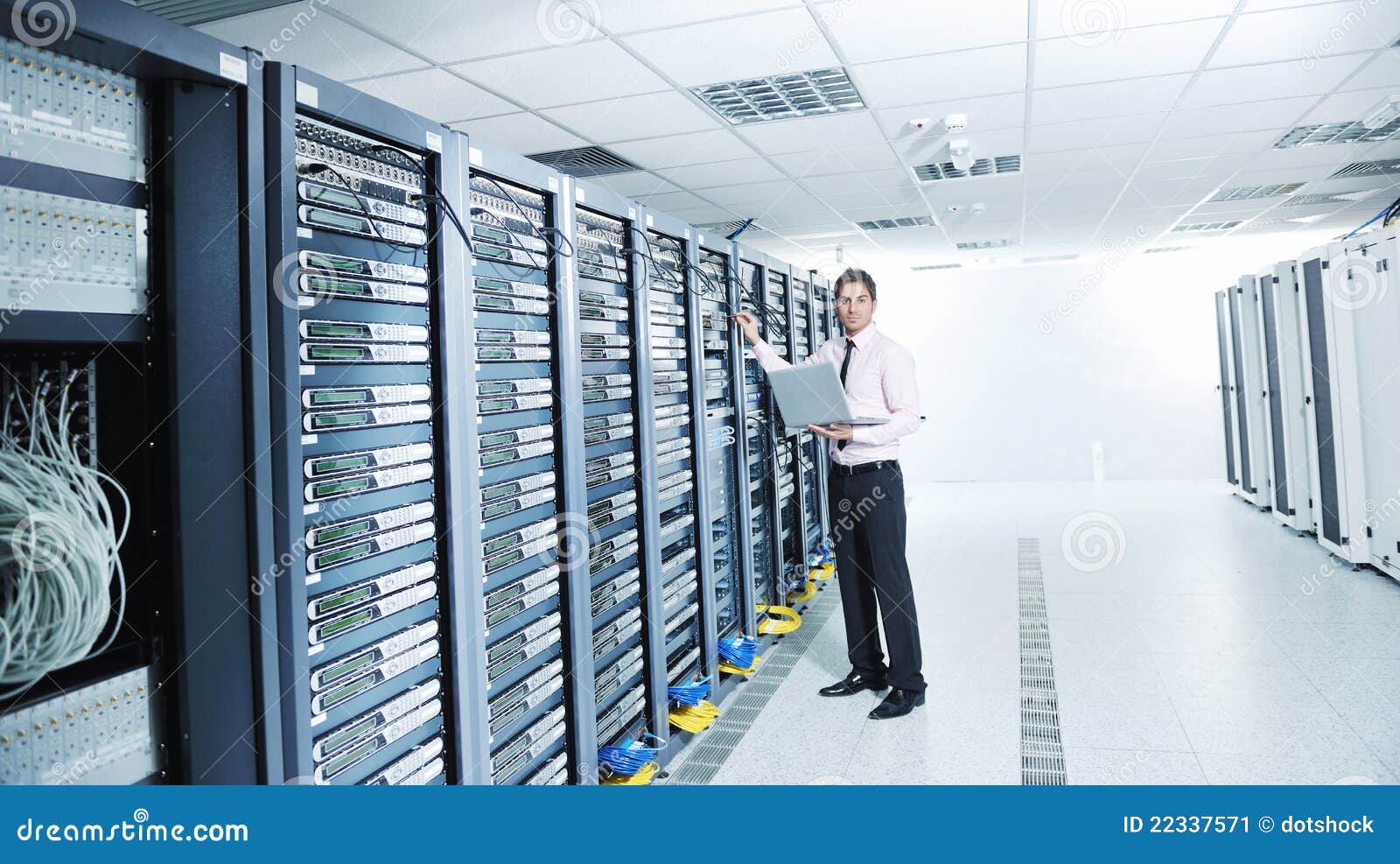 Businessman with Laptop in Network Server Room Stock Image - Image of ...