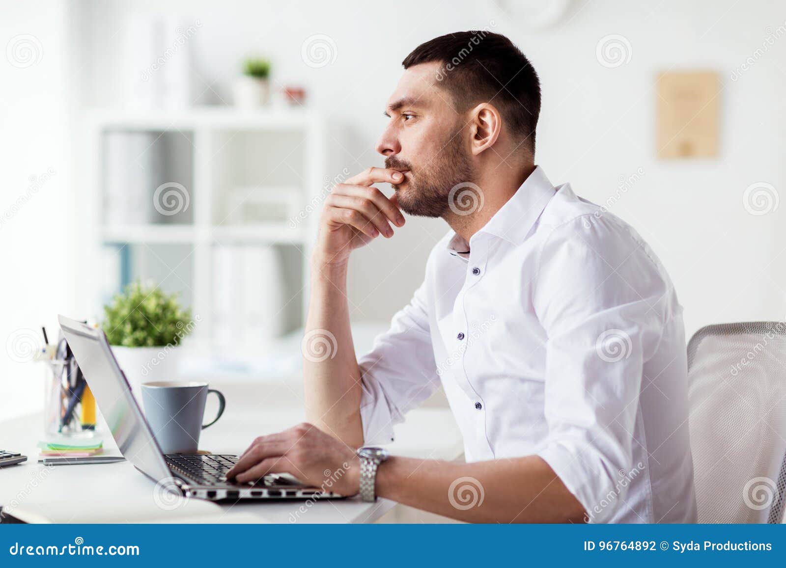 Businessman with Laptop Thinking at Office Stock Photo - Image of ...
