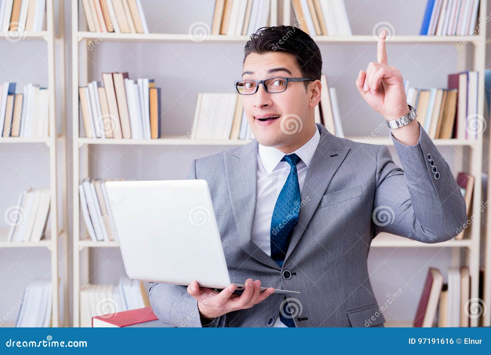 The Businessman with a Laptop Working in the Library Stock Photo ...