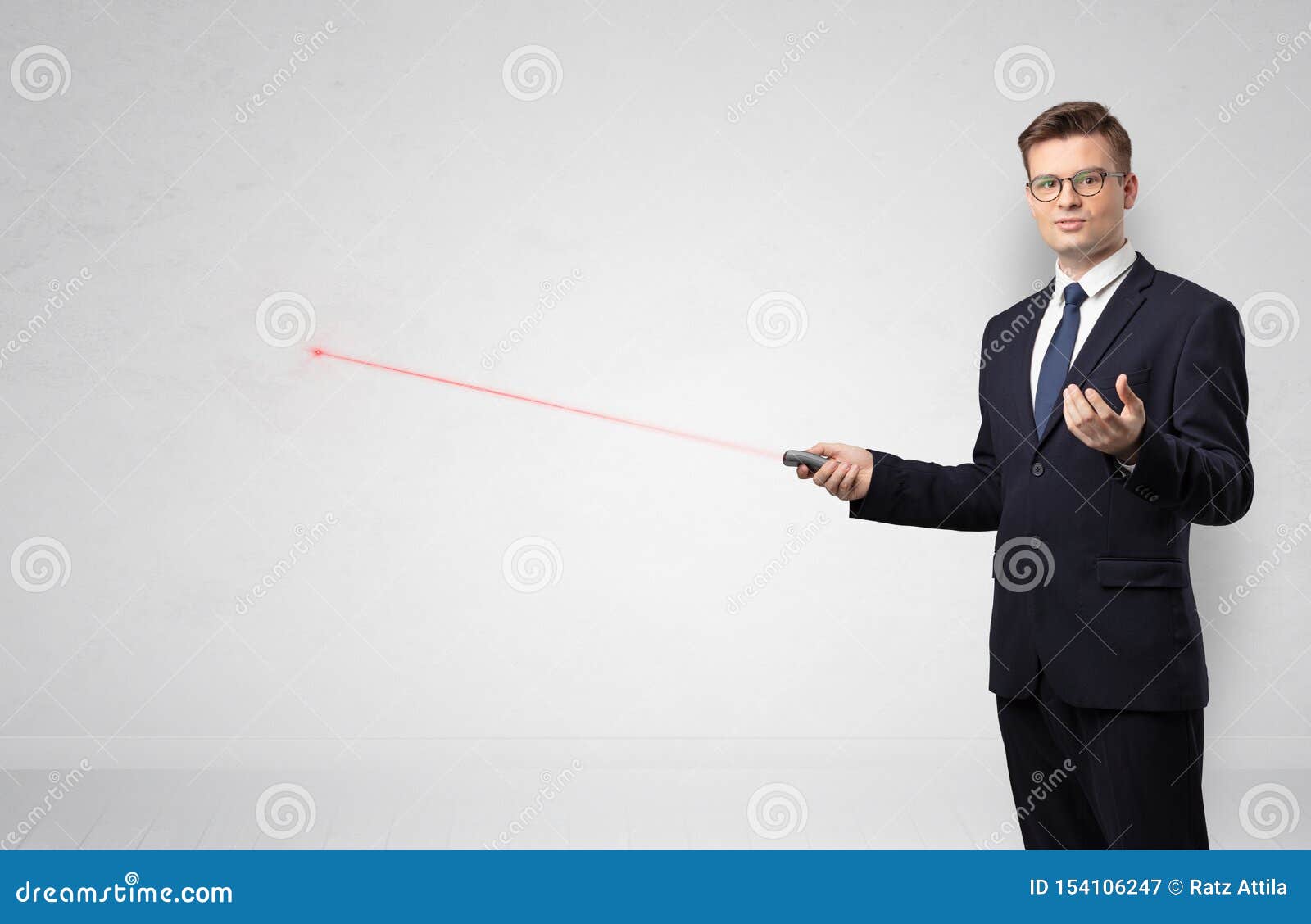 Businessman with Laser Pointer and Copyspace White Wall Stock Image ...